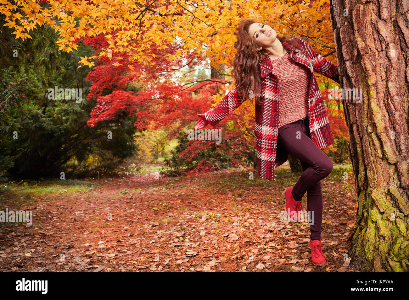 Beautiful woman in autumn park Stock Photo - Alamy
