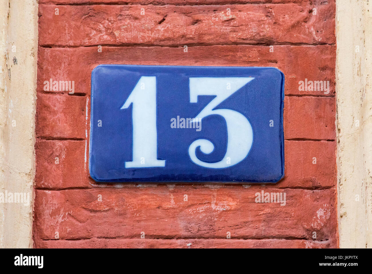A number 13 plaque on the exterior of a building Stock Photo - Alamy