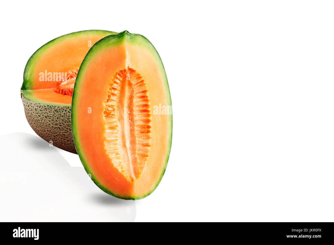 Colorful melon cut on a white background Stock Photo - Alamy