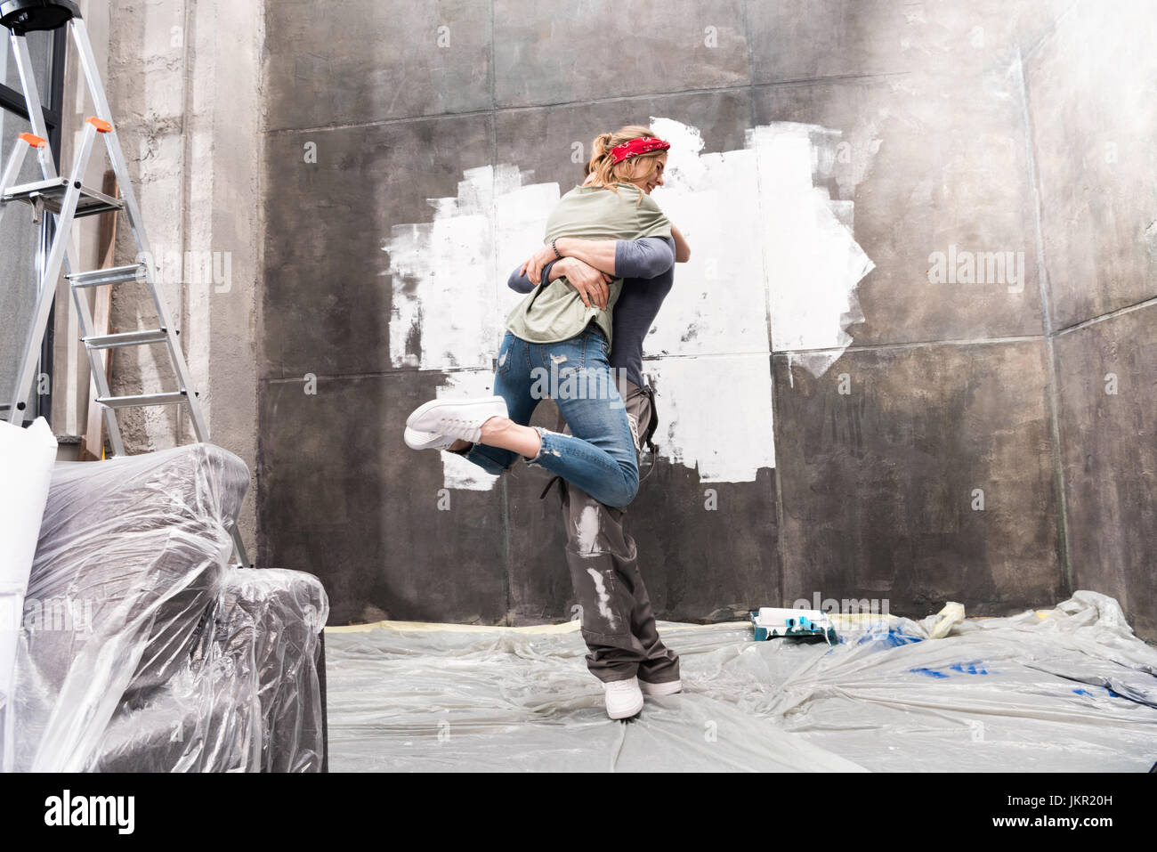 young happy couple having fun, renovation home concept Stock Photo - Alamy