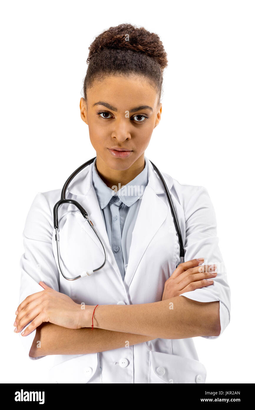 Confident young professional female doctor standing with stethoscope ...