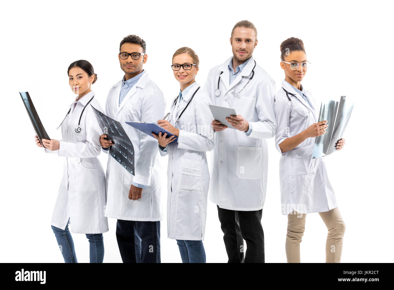Group of young smiling professional doctors standing together isolated ...