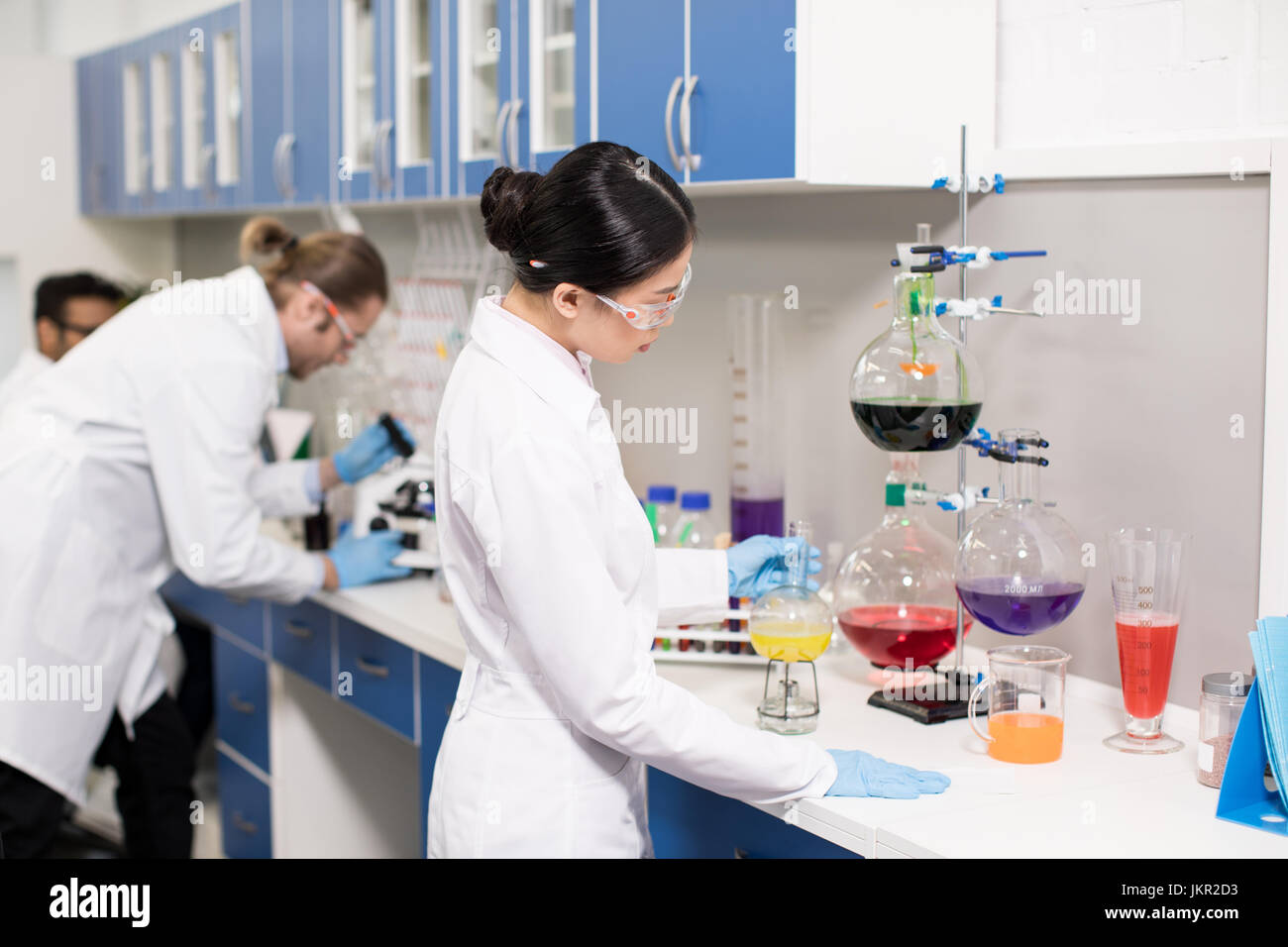 Group scientists working laboratory tubes hi-res stock photography and ...