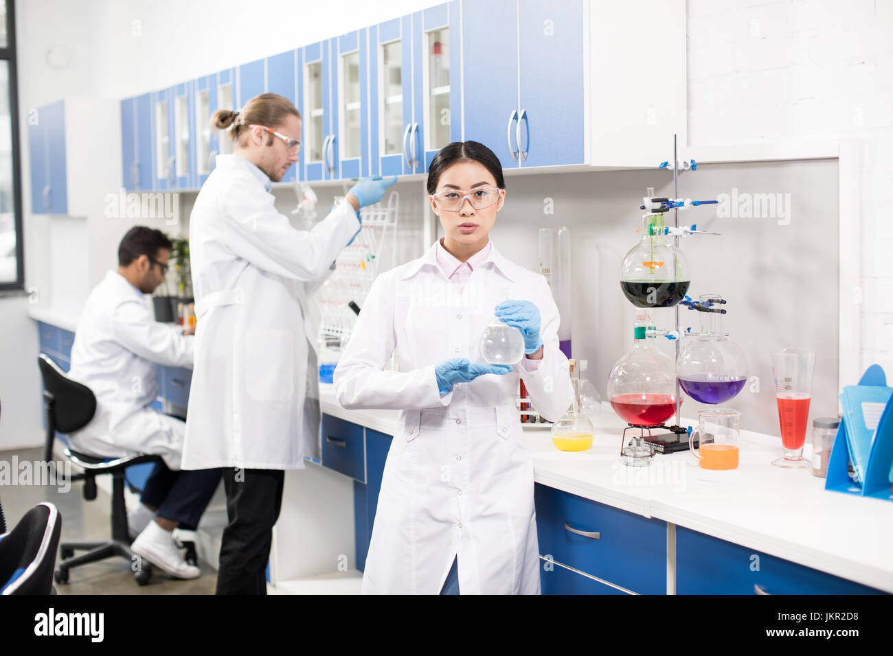 Group scientists working laboratory tubes hi-res stock photography and images - Alamy