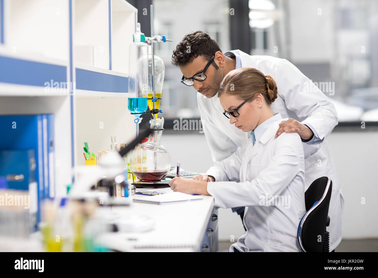 side view of scientists working in laboratory Stock Photo - Alamy