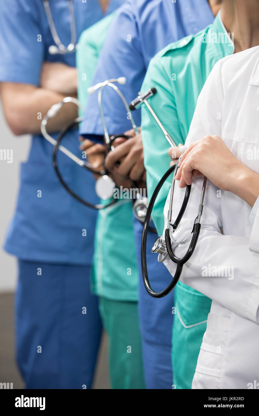 partial view of group of medical workers with equipment in laboratory ...