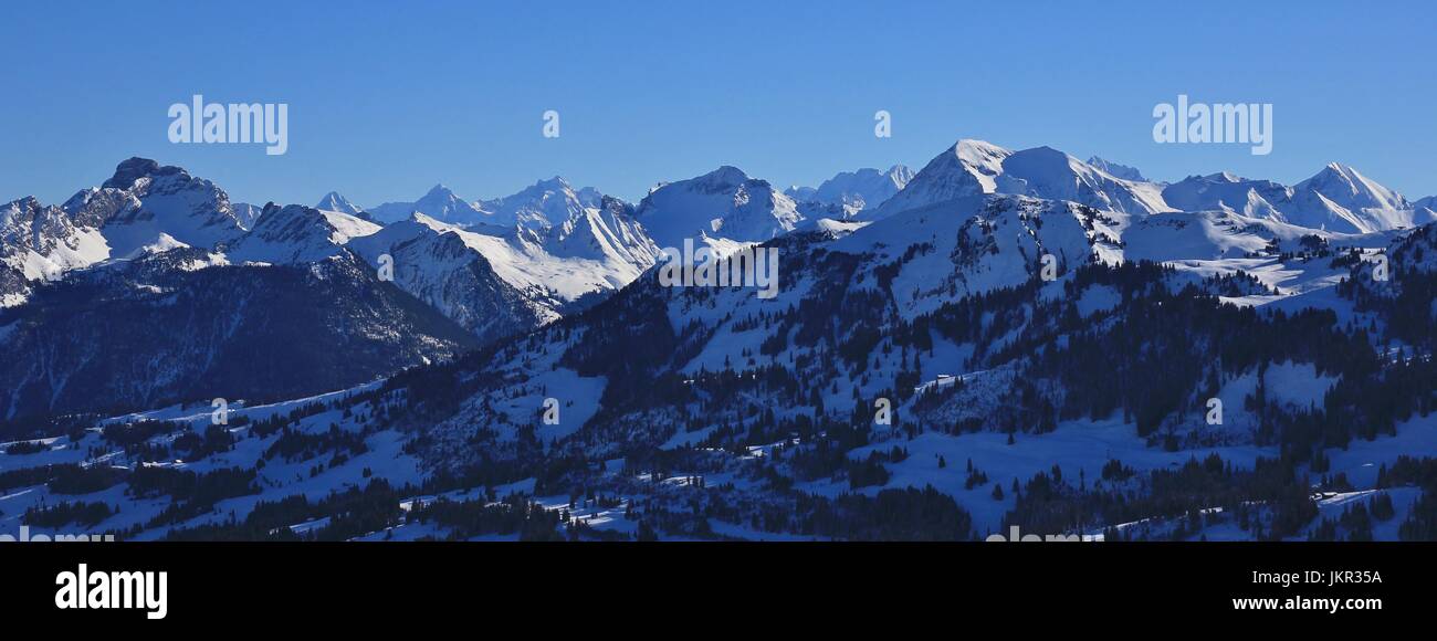 Winter scene in the Swiss Alps. Snow covered mountain ranges Stock ...