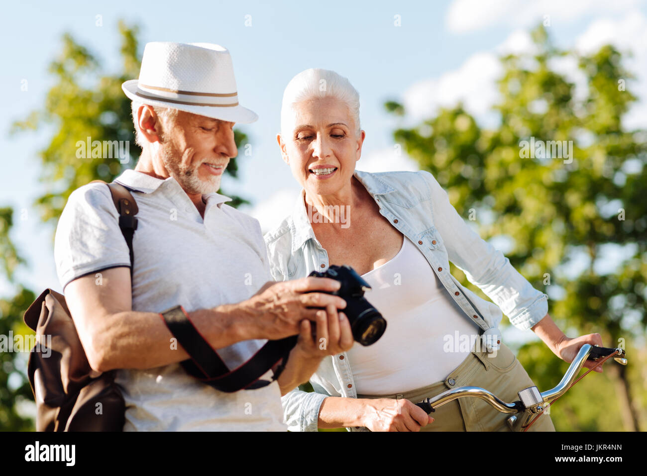 Attentive man checking perfect shots Stock Photo - Alamy