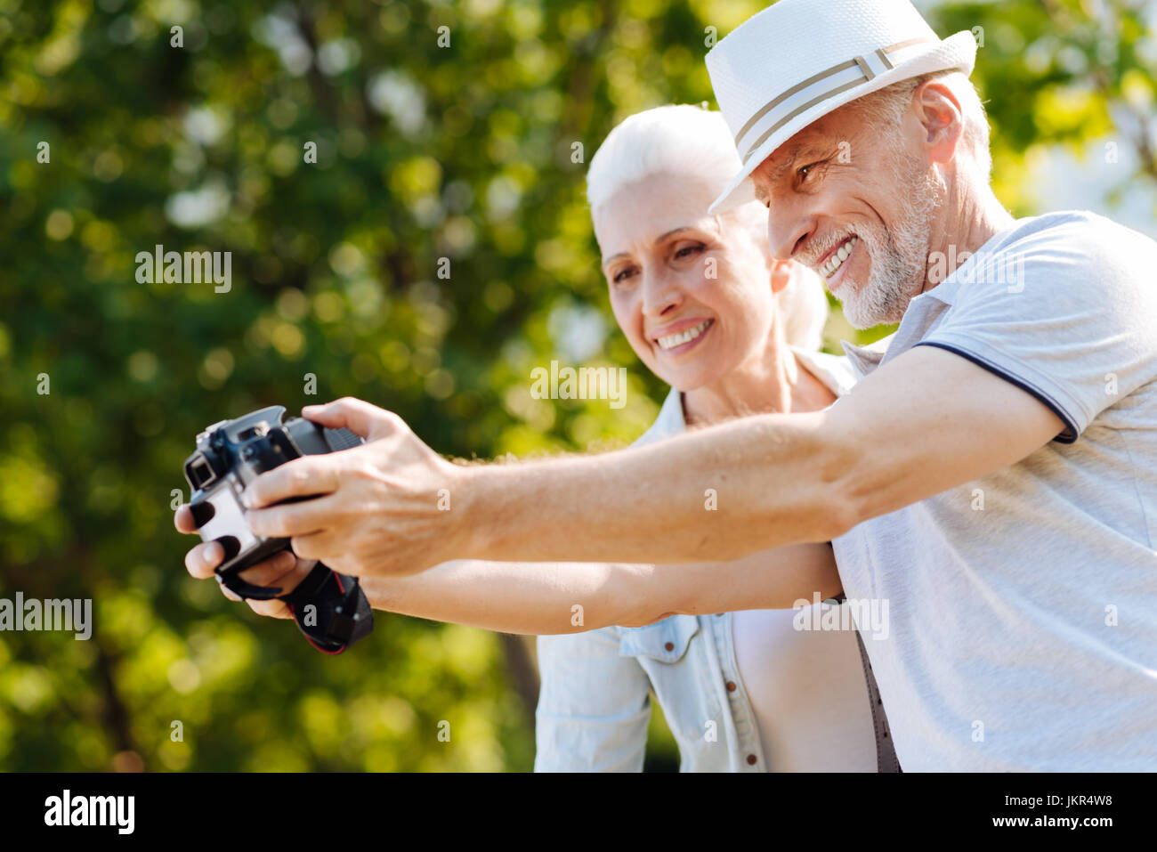 Positive delighted people smiling while walking Stock Photo - Alamy