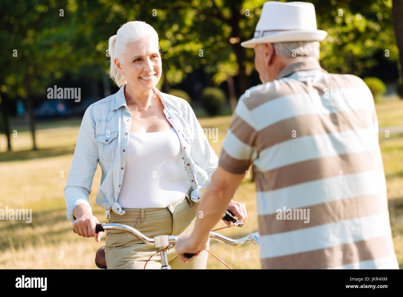 Charming lady communicating with her friend Stock Photo - Alamy