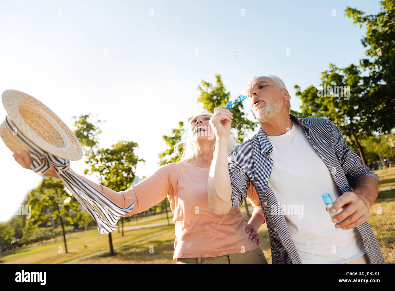 Joyful couple feeling happiness while walking Stock Photo - Alamy