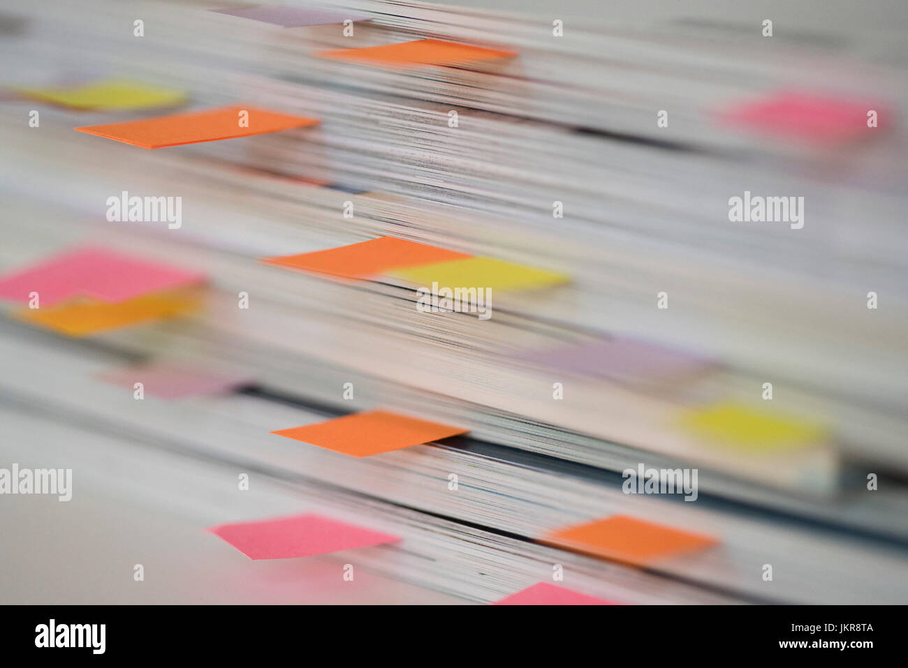Close-up of stack of books with colorful bookmarks Stock Photo - Alamy