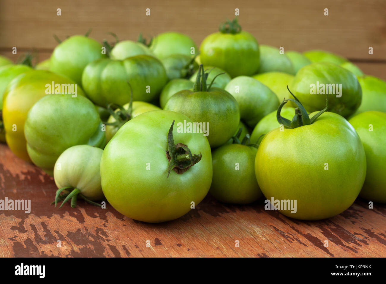 Green Tomatoes. Unripe Green Tomatoes On Wooden Table Close Up ...