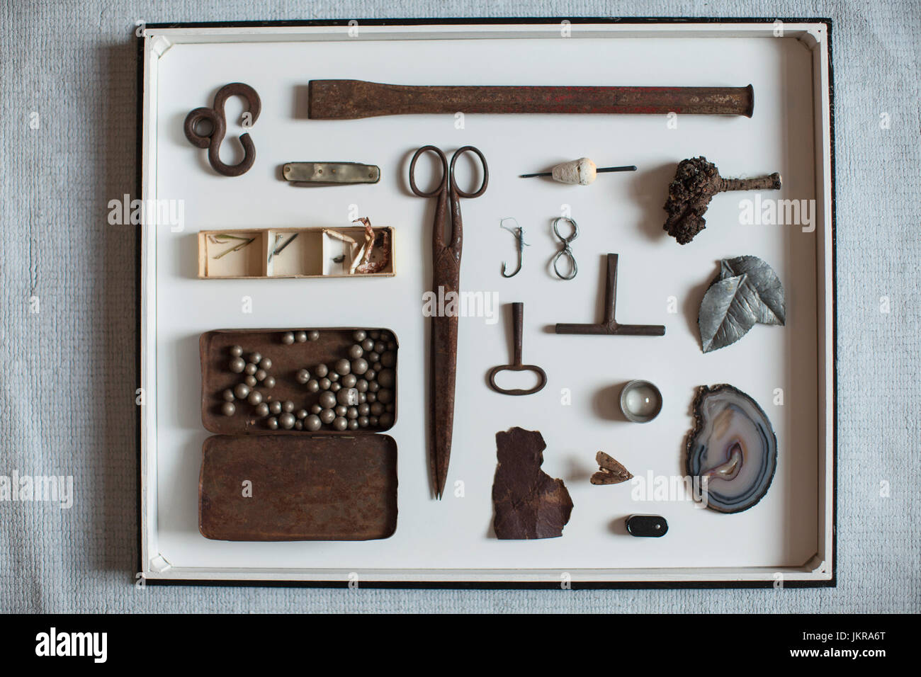 Directly above shot of old objects in tray on table Stock Photo - Alamy