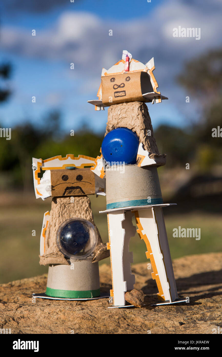 Cardboard characters on stone against sky during sunny day Stock Photo ...