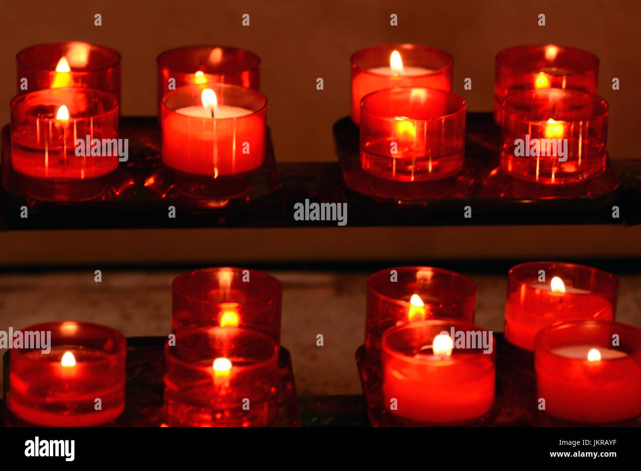 Photo of lit, red candles Stock Photo - Alamy