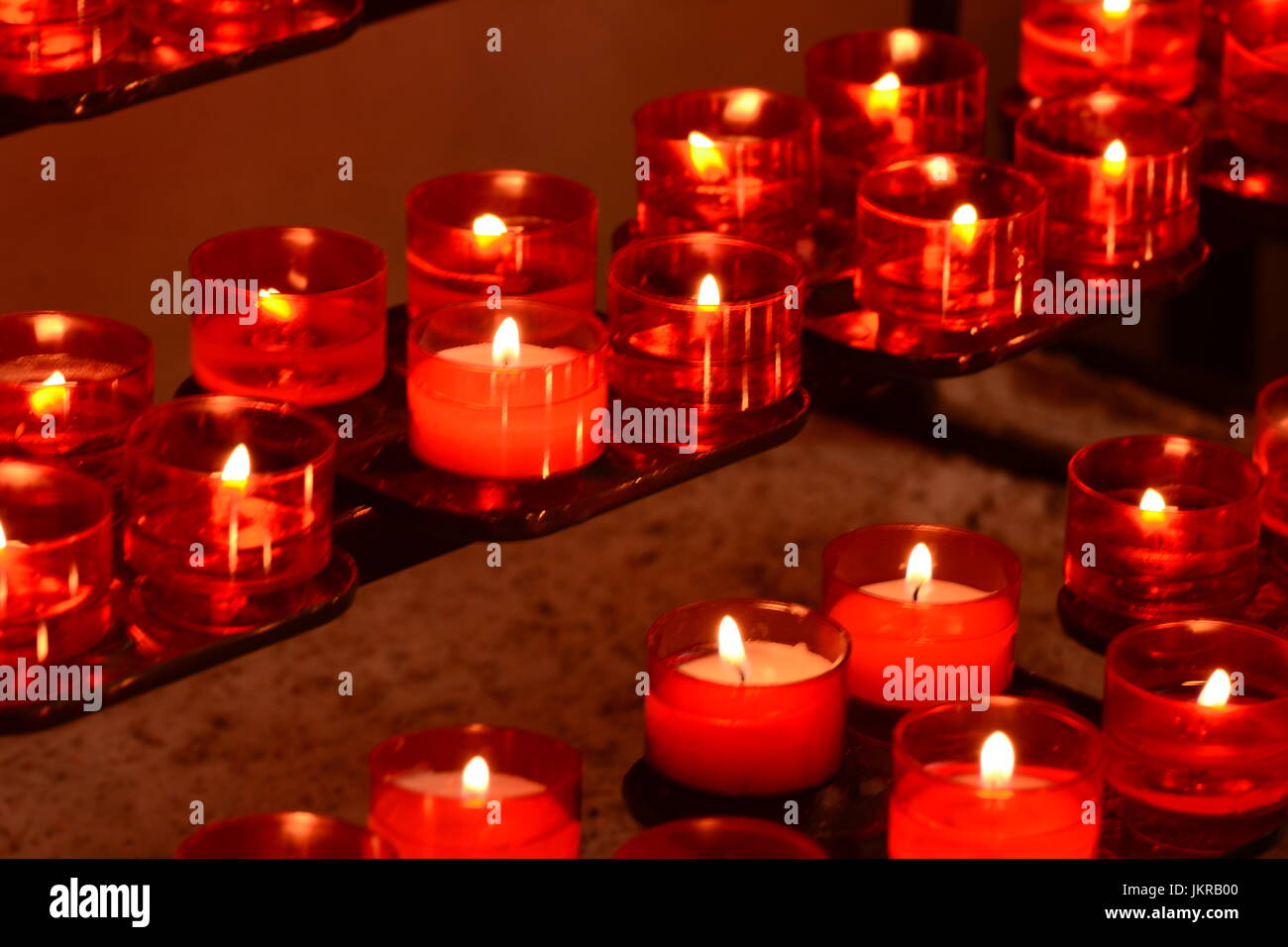 Photo of lit, red candles Stock Photo - Alamy