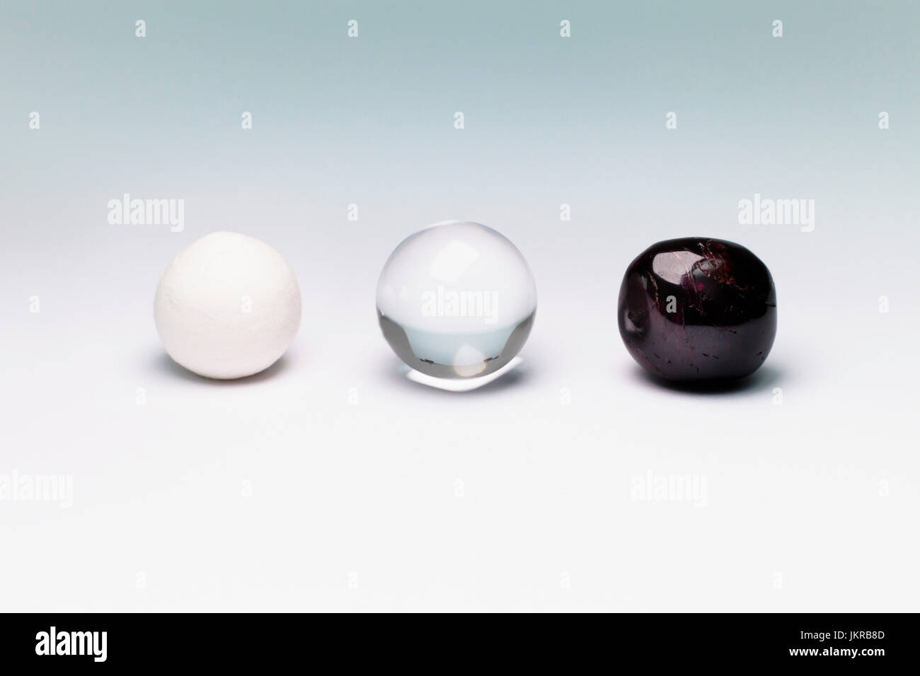 Various marbles arranged on white background Stock Photo - Alamy