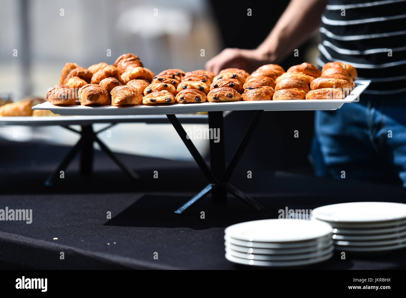Table full with fresh pastry products during event Stock Photo - Alamy