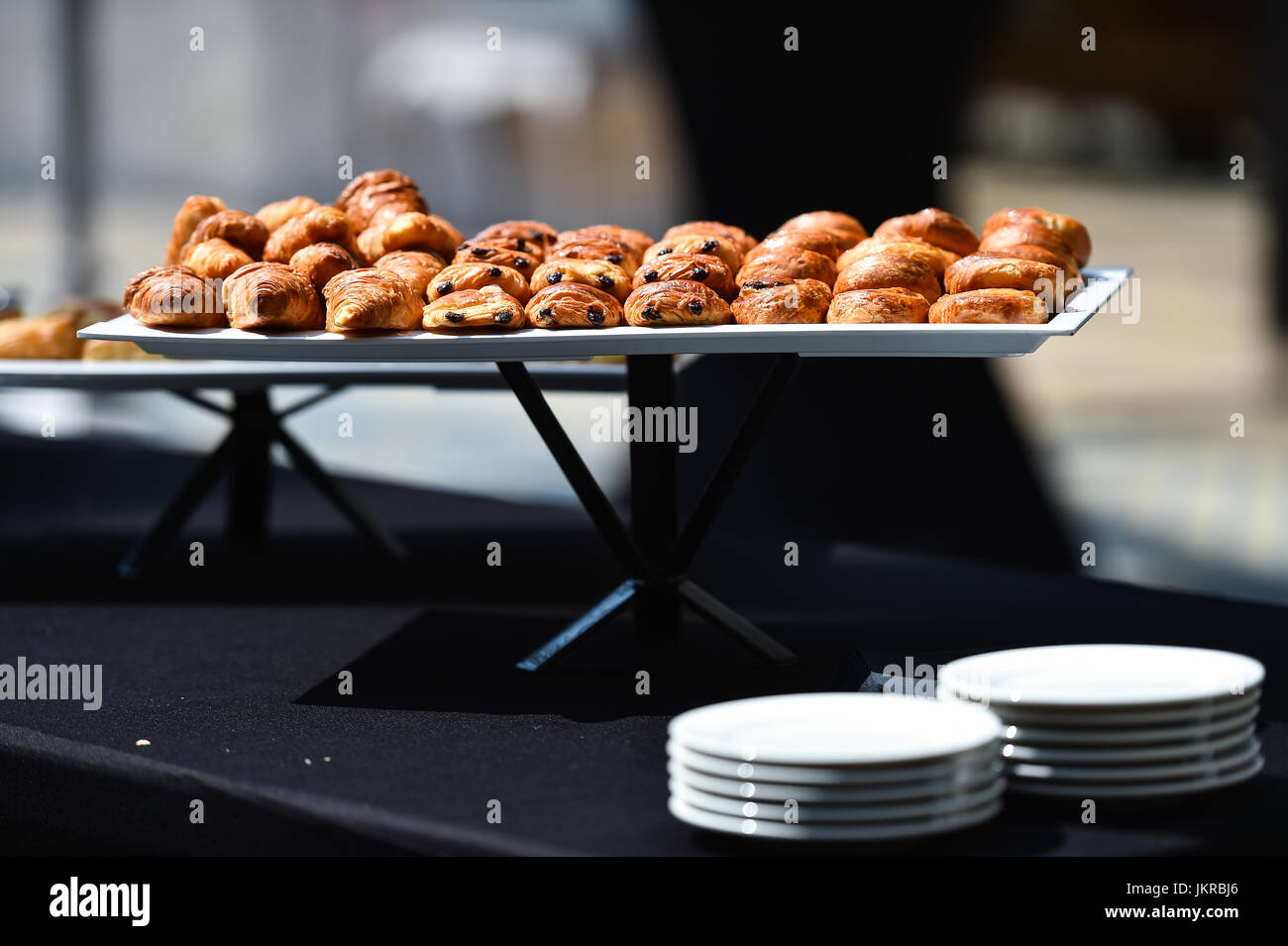 Table full with fresh pastry products during event Stock Photo - Alamy
