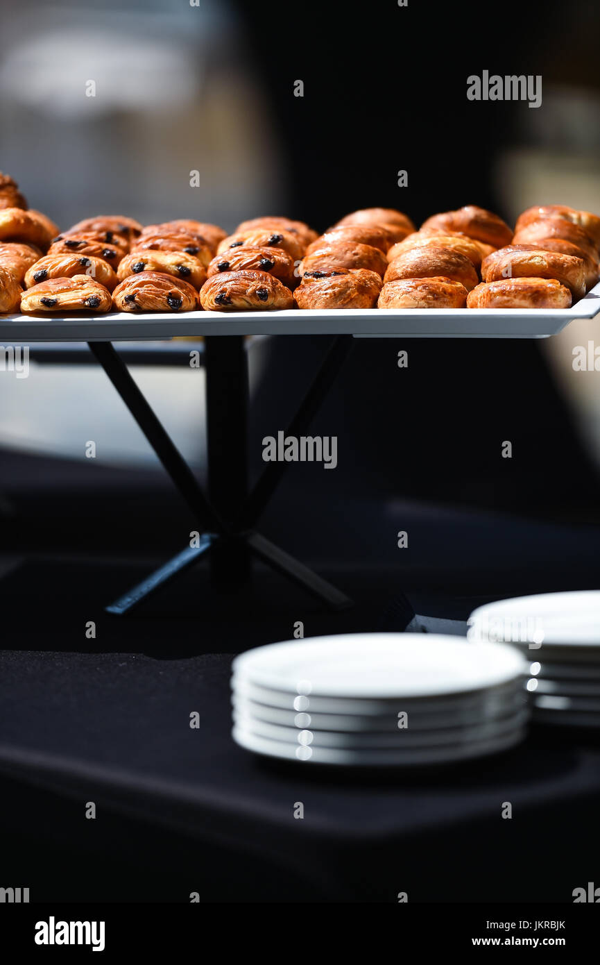 Table full with fresh pastry products during event Stock Photo - Alamy