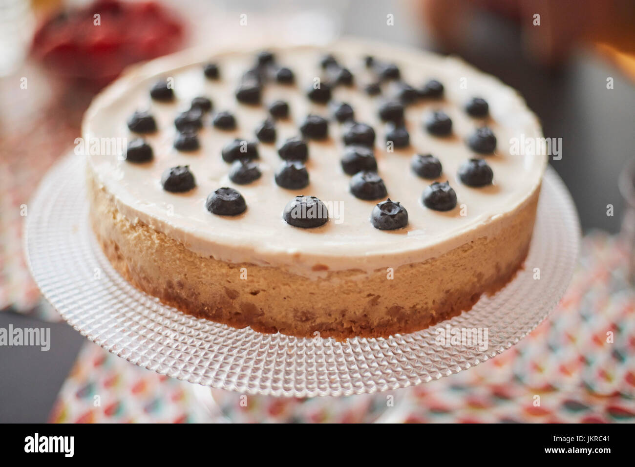 High angle close-up of cake on stand at table Stock Photo - Alamy