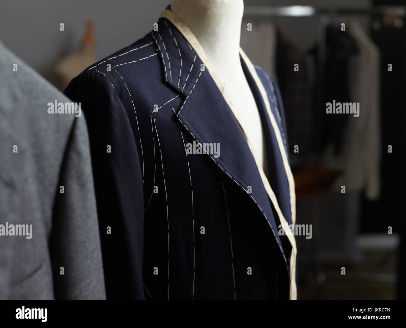 Suit jacket on dressmaker's model in design studio Stock Photo - Alamy