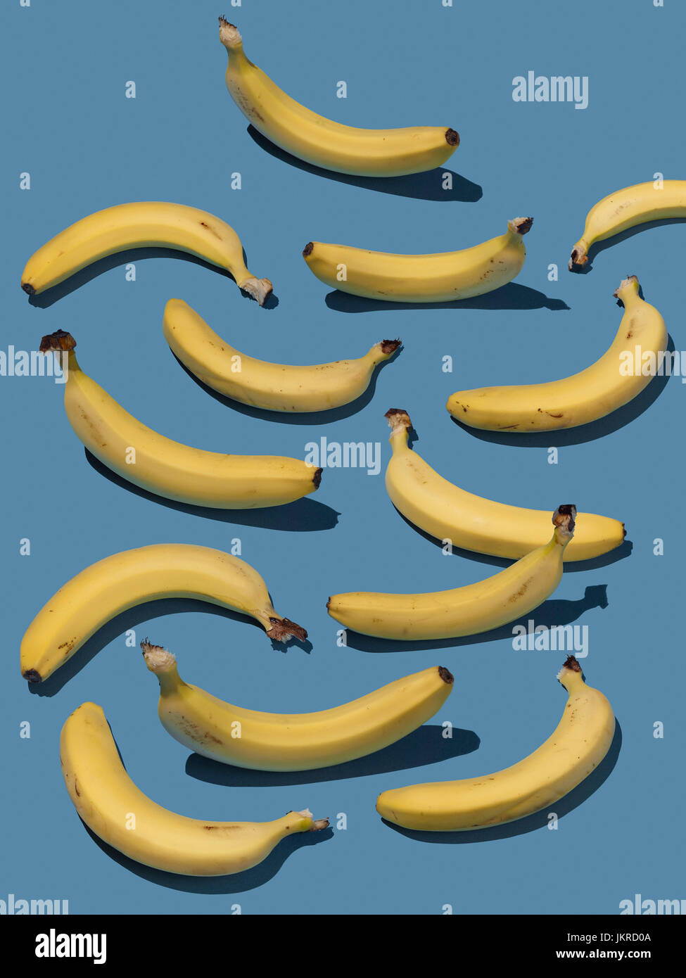 High angle view of bananas on blue background Stock Photo - Alamy