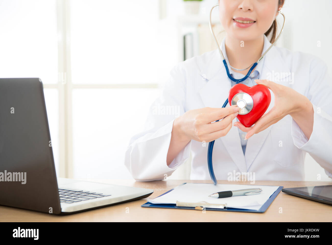 closeup photo of online service cardiologist woman using stethoscope ...