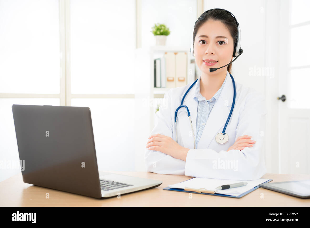 young female doctor agent practitioner working at the office and she ...