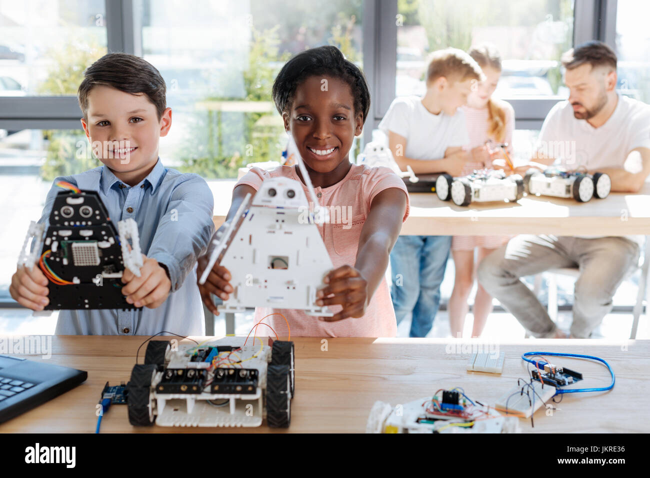 Best friends showing their robot models Stock Photo - Alamy