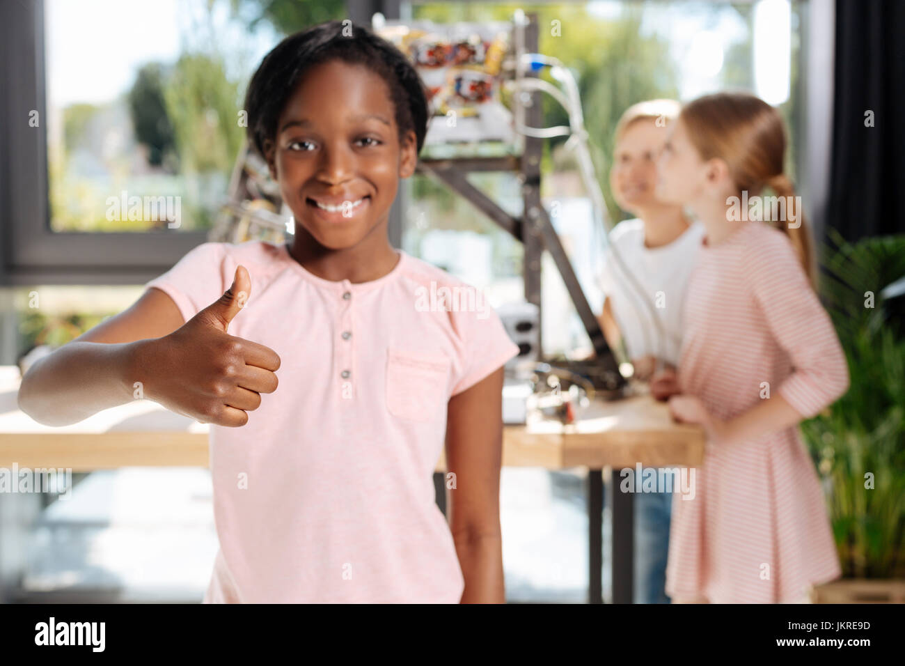 School children showing thumbs up hi-res stock photography and images ...