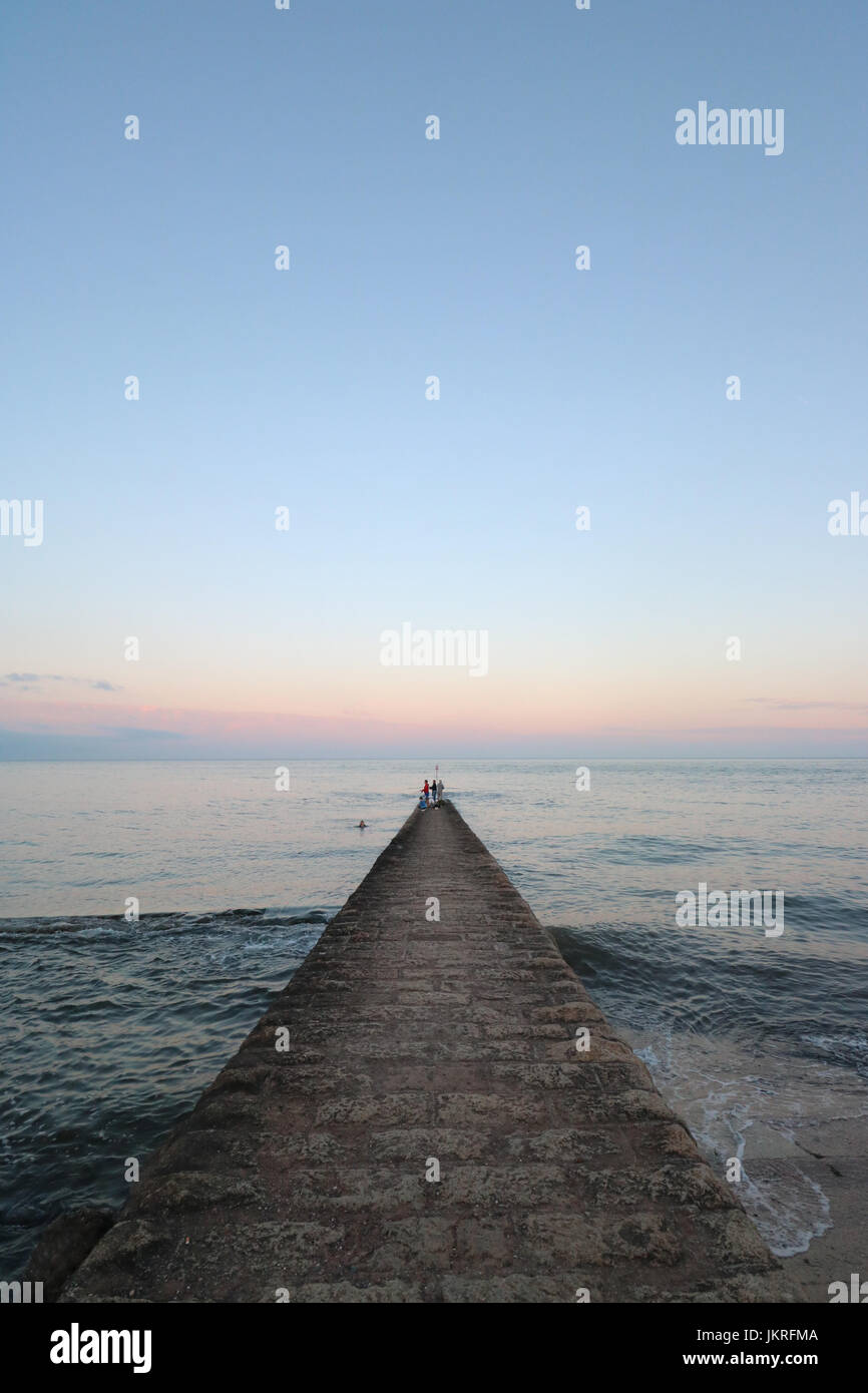 Long pathway leading to the horizon during sunset Stock Photo - Alamy