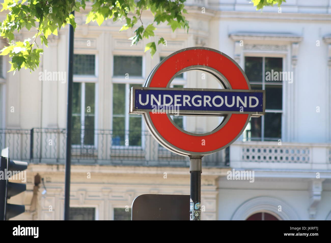 A London Underground circular sign depicting entrance to a subway ...