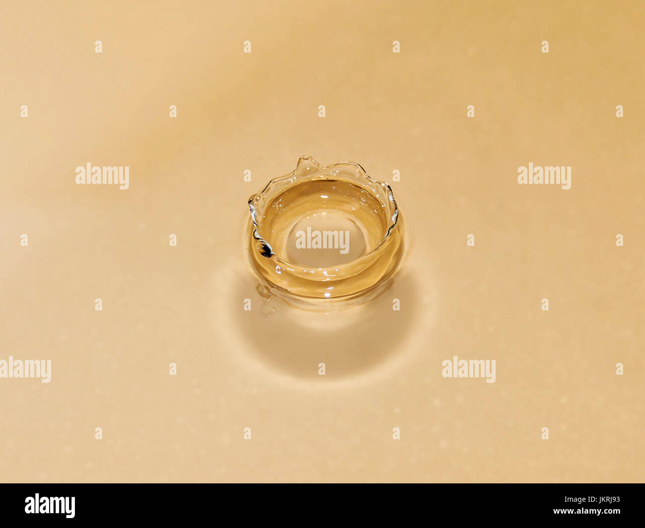 Splash of water from a drop falling from a height Stock Photo - Alamy