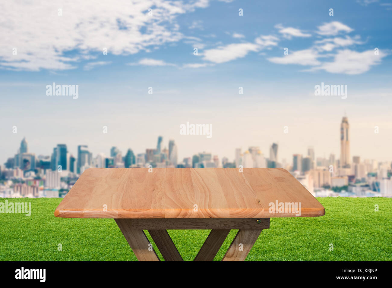 wooden table with blue sky and cityscape background Stock Photo - Alamy