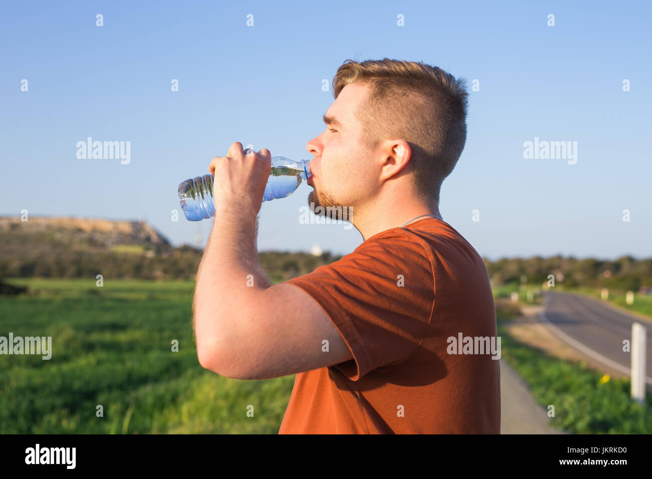 Muscular men drinking water from hi-res stock photography and images ...