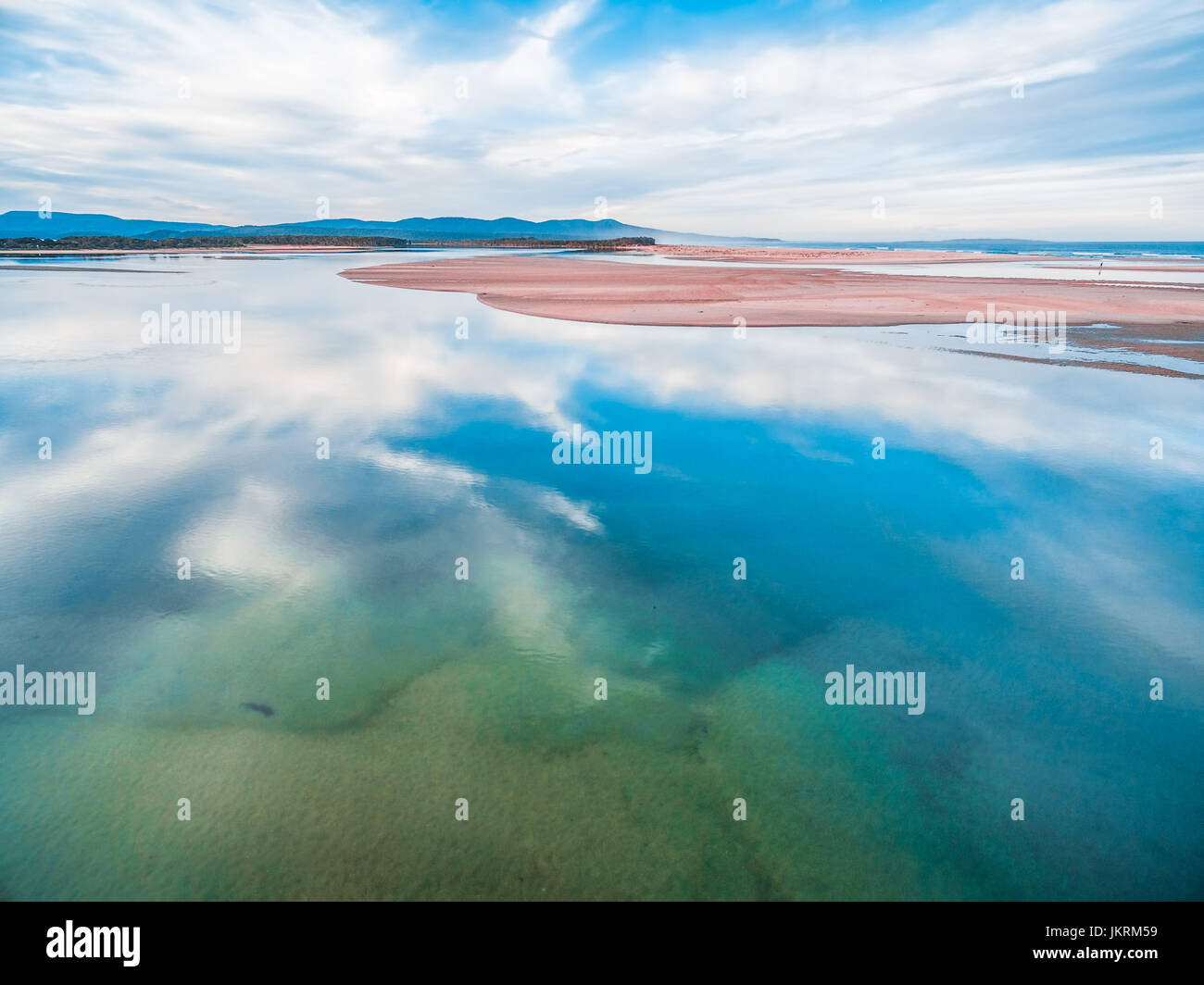 Aerial landscape - beautiful sky reflecting in shallow ocean water ...