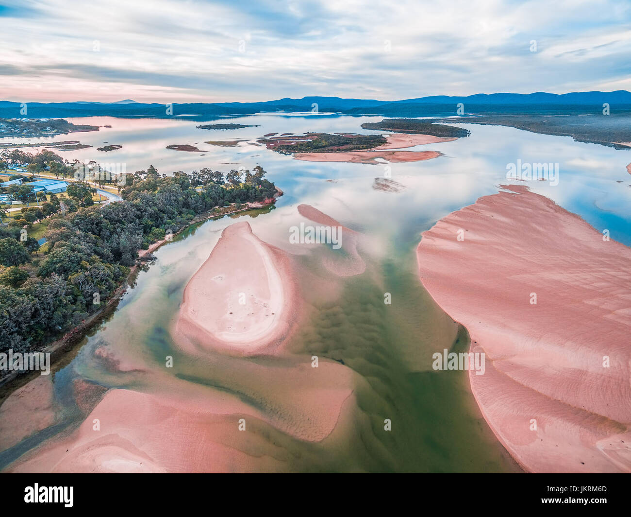 Aerial landscape - beautiful sky reflecting in shallow ocean water and ...