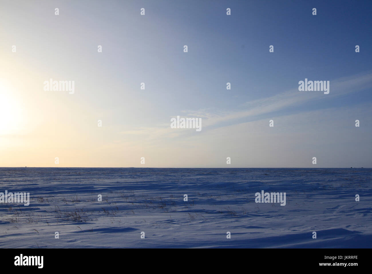 Winter arctic landscape with snow on the ground and setting sun Stock ...