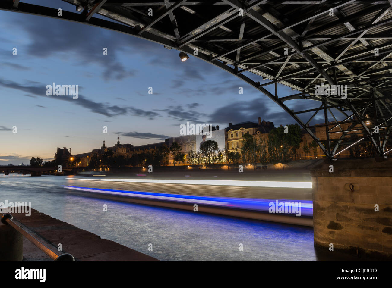 Paris sunset under pont des arts bridge Stock Photo - Alamy