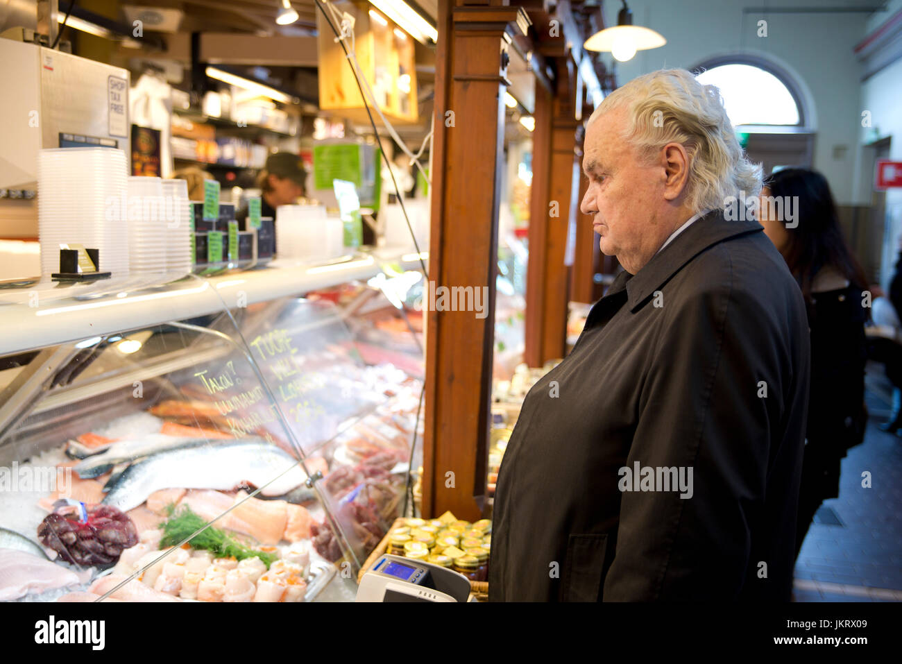 man looking at deli meat counter, helsinki market Stock Photo - Alamy