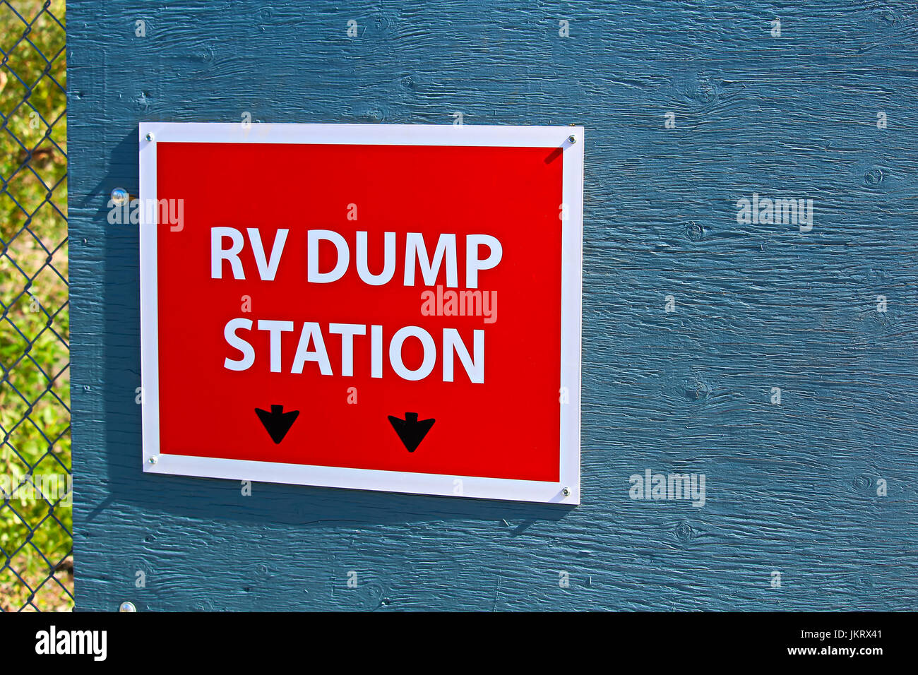 An RV dump station sign on the edge of a building Stock Photo - Alamy