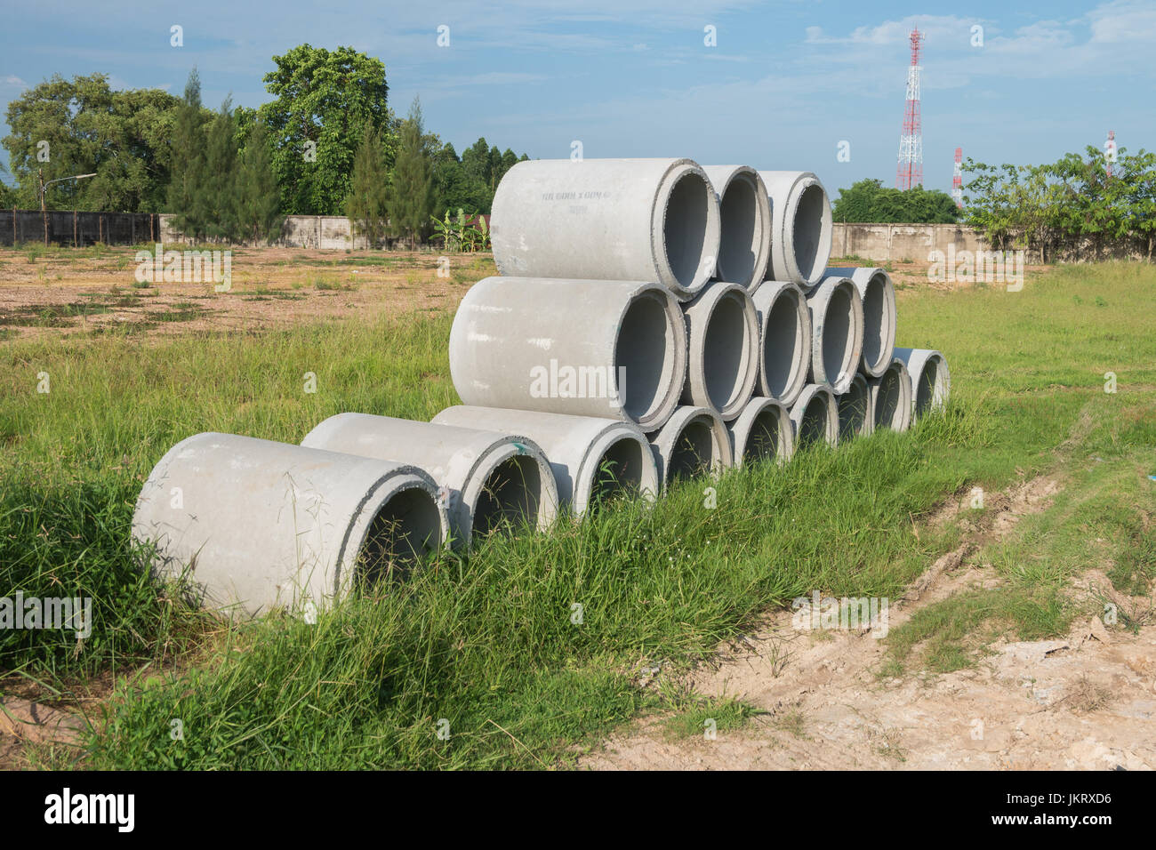 Stacked concrete pipes on a construction site Stock Photo - Alamy