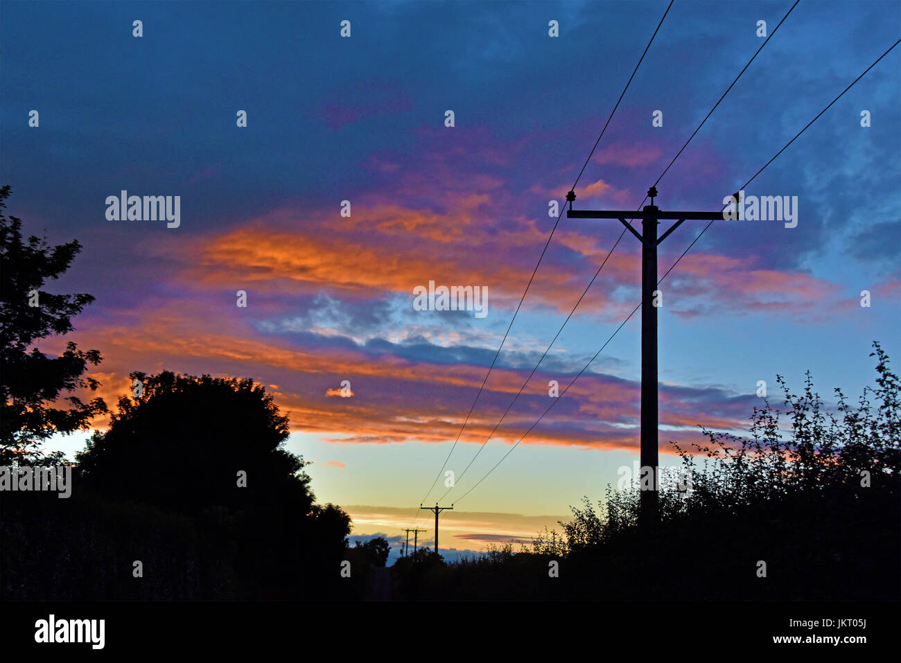 Electric overhead power lines with sunset sky. Mindrum, nesr Cornhill ...