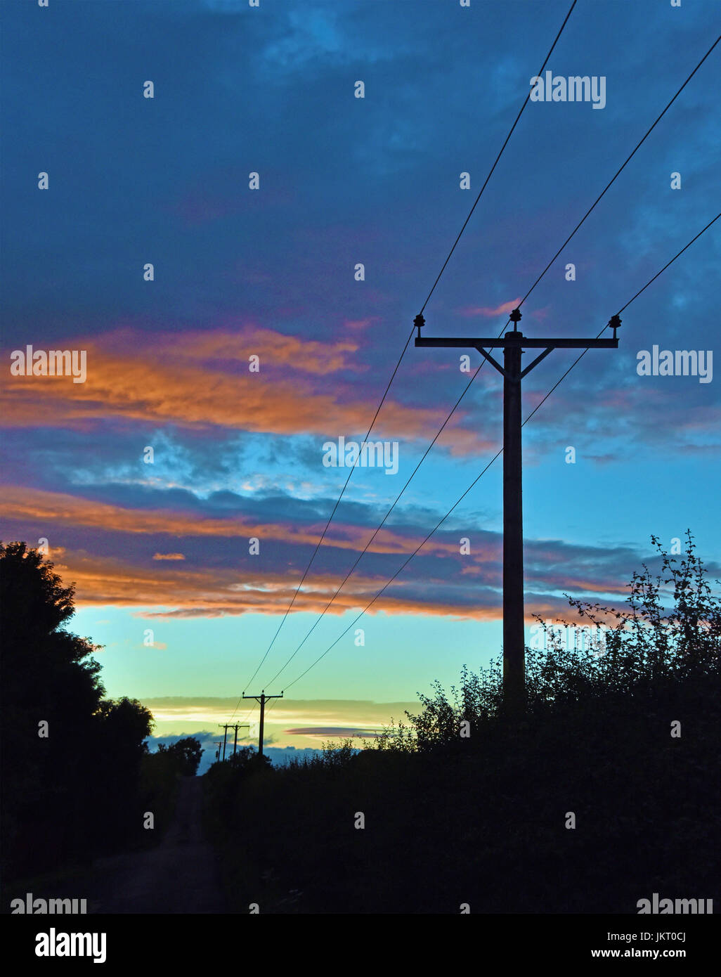 Electric overhead power lines with sunset sky. Mindrum, nesr Cornhill ...