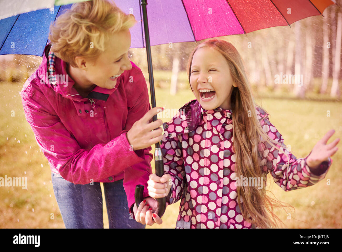 Colorful umbrella will protect us from the rain Stock Photo - Alamy