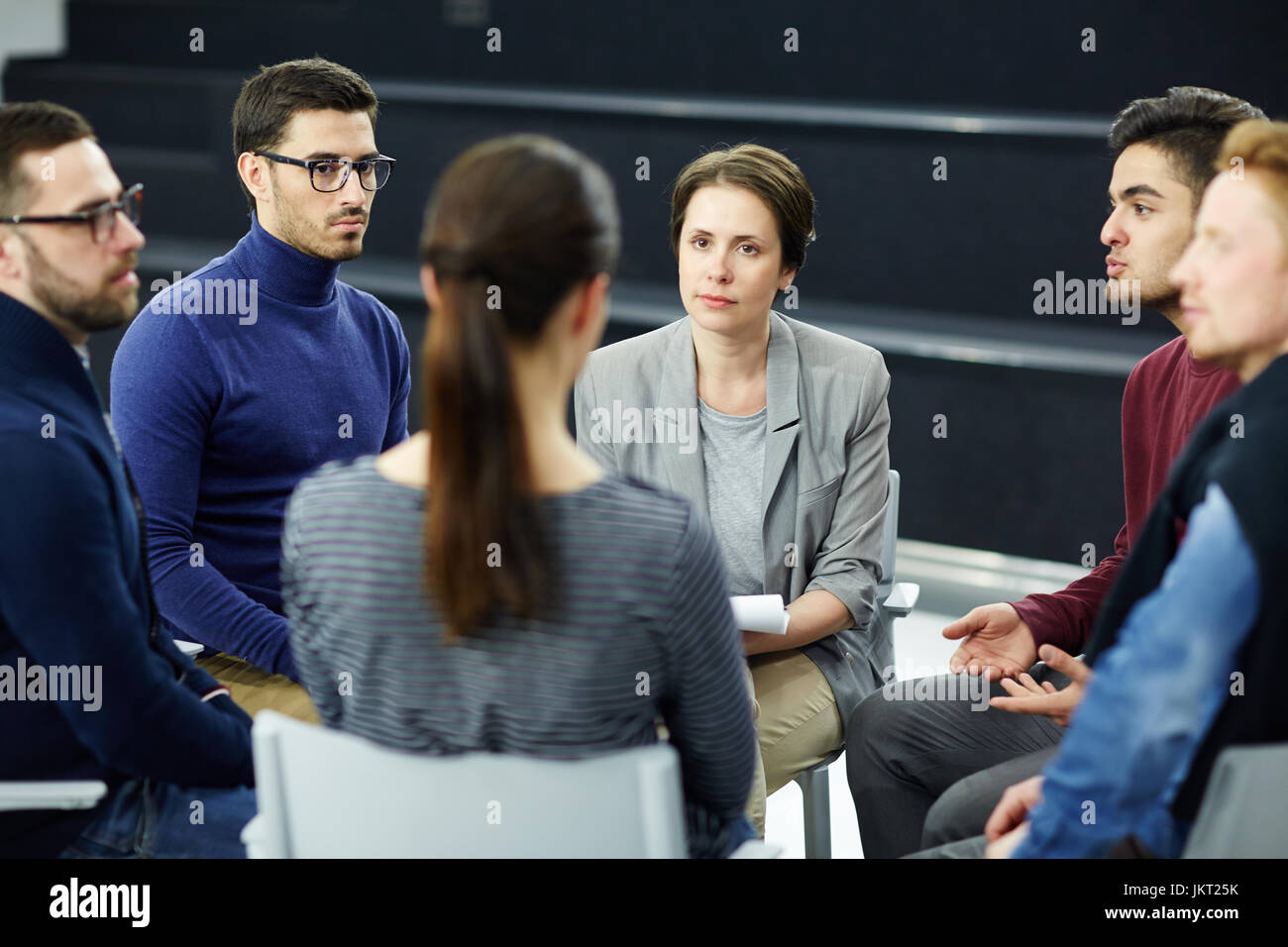 Group of students sharing their problems during psychological session ...