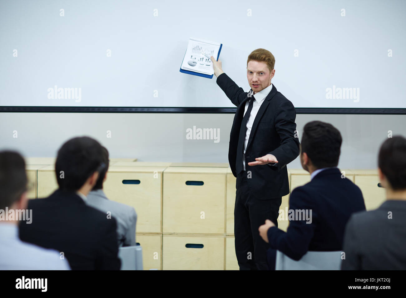 Lecturer pointing whiteboard hi-res stock photography and images - Alamy