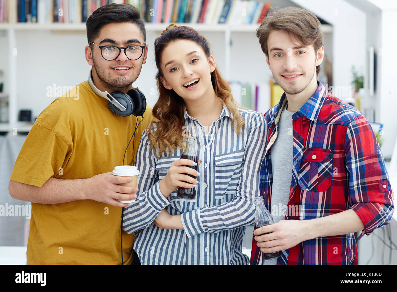 Young staff with drinks enjoying break after lesson Stock Photo - Alamy